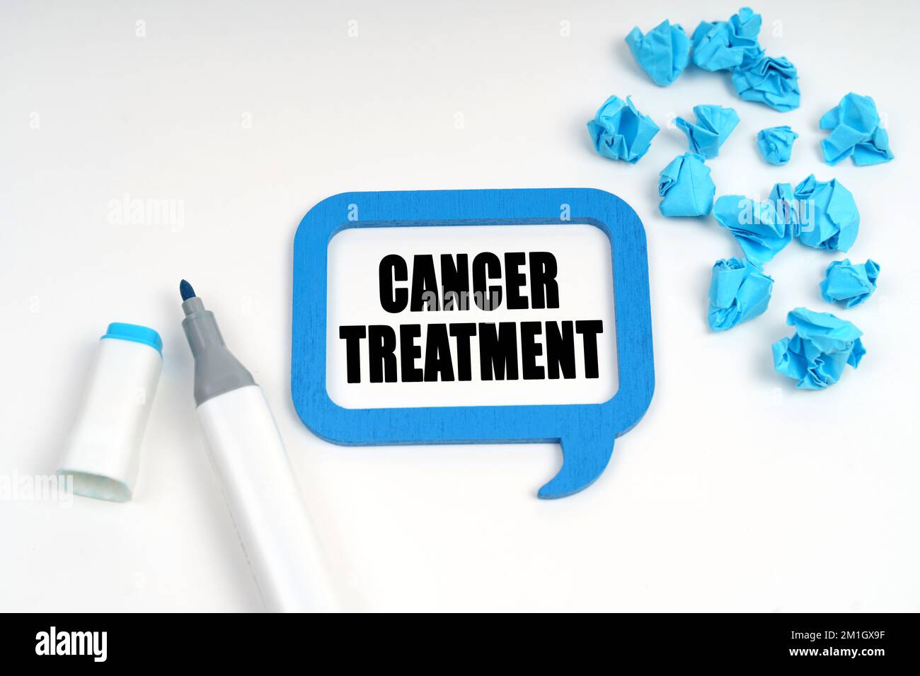 Medicine and health. On a white surface are crumpled blue paper, a ...