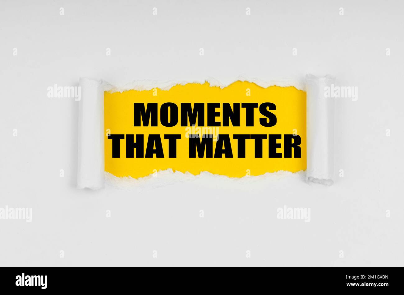 A window is made in the paper, where on a yellow background the ...