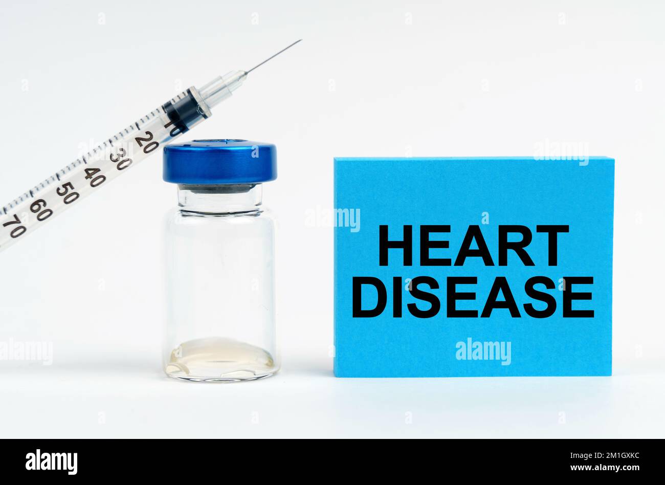 Medicine concept. On the table is a syringe, an injection and a blue ...