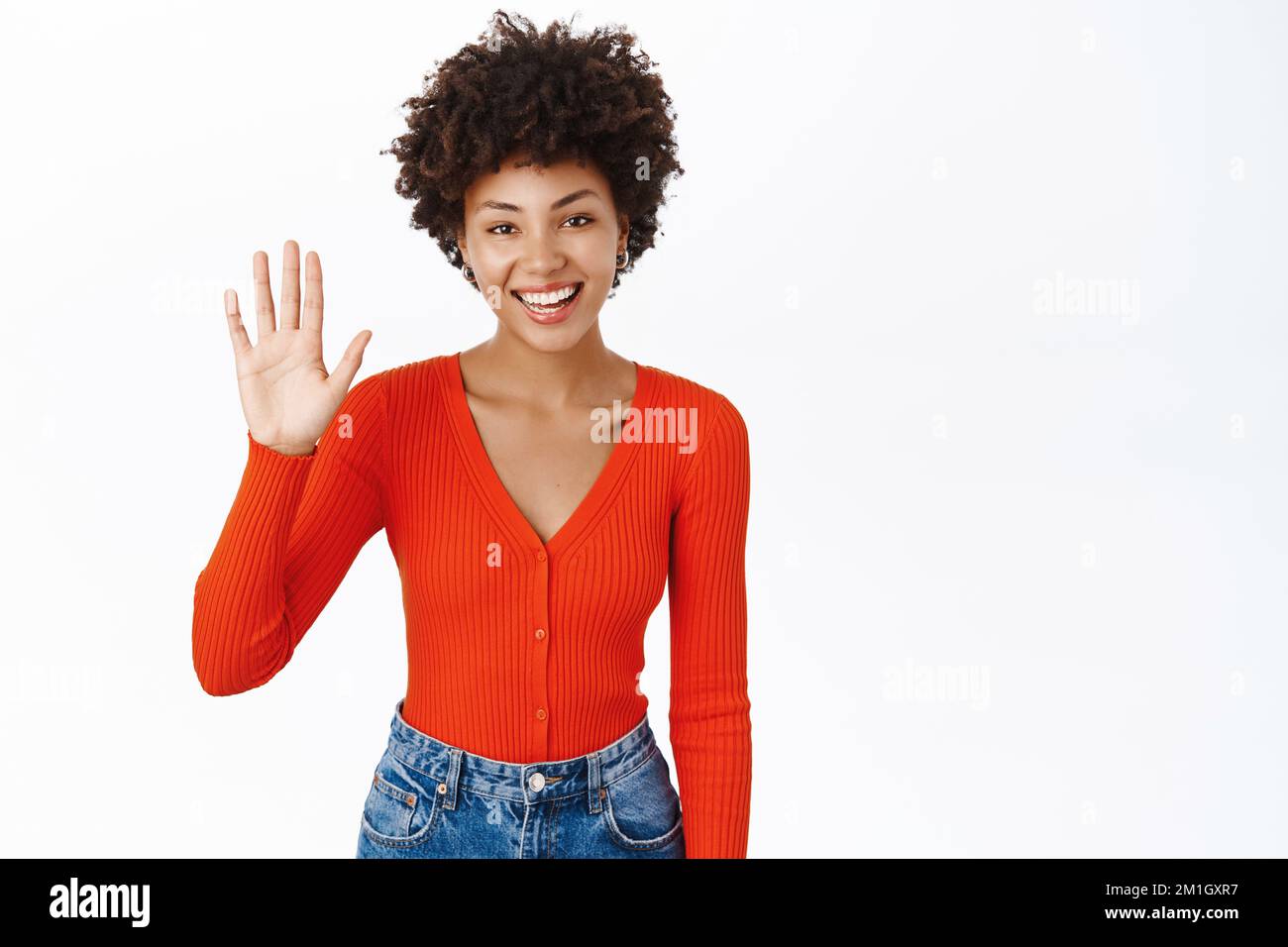 Beautiful smiling woman saying hello, making friendly wave gesture, hi ...