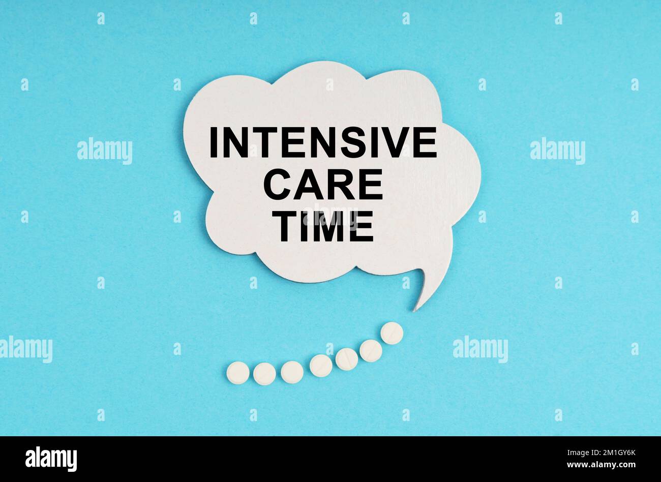 Medicine and health concept. On a blue table are pills and a white ...