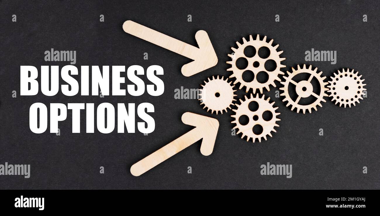 Business and finance concept. On the black surface, arrows, gears and ...