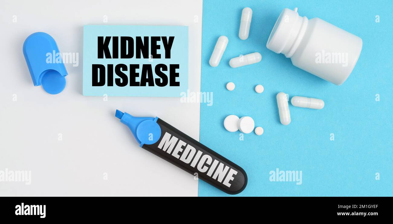 Medical concept. On the white and blue surface are pills, a marker and ...