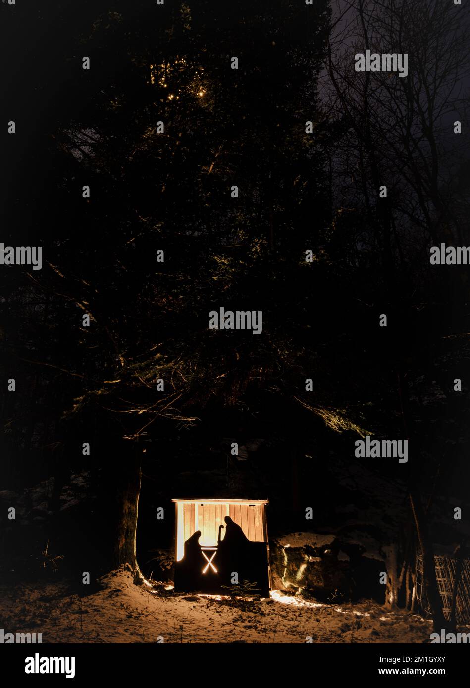 A vertical shot of a silhouette of a Jesus birth nativity scene in a ...