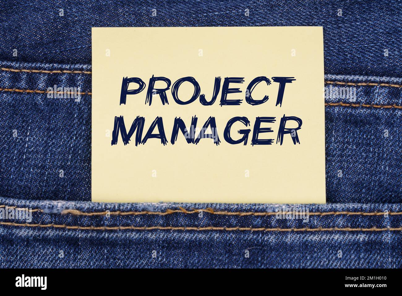 Economy and education concept. There is a paper sticking out of a jeans ...