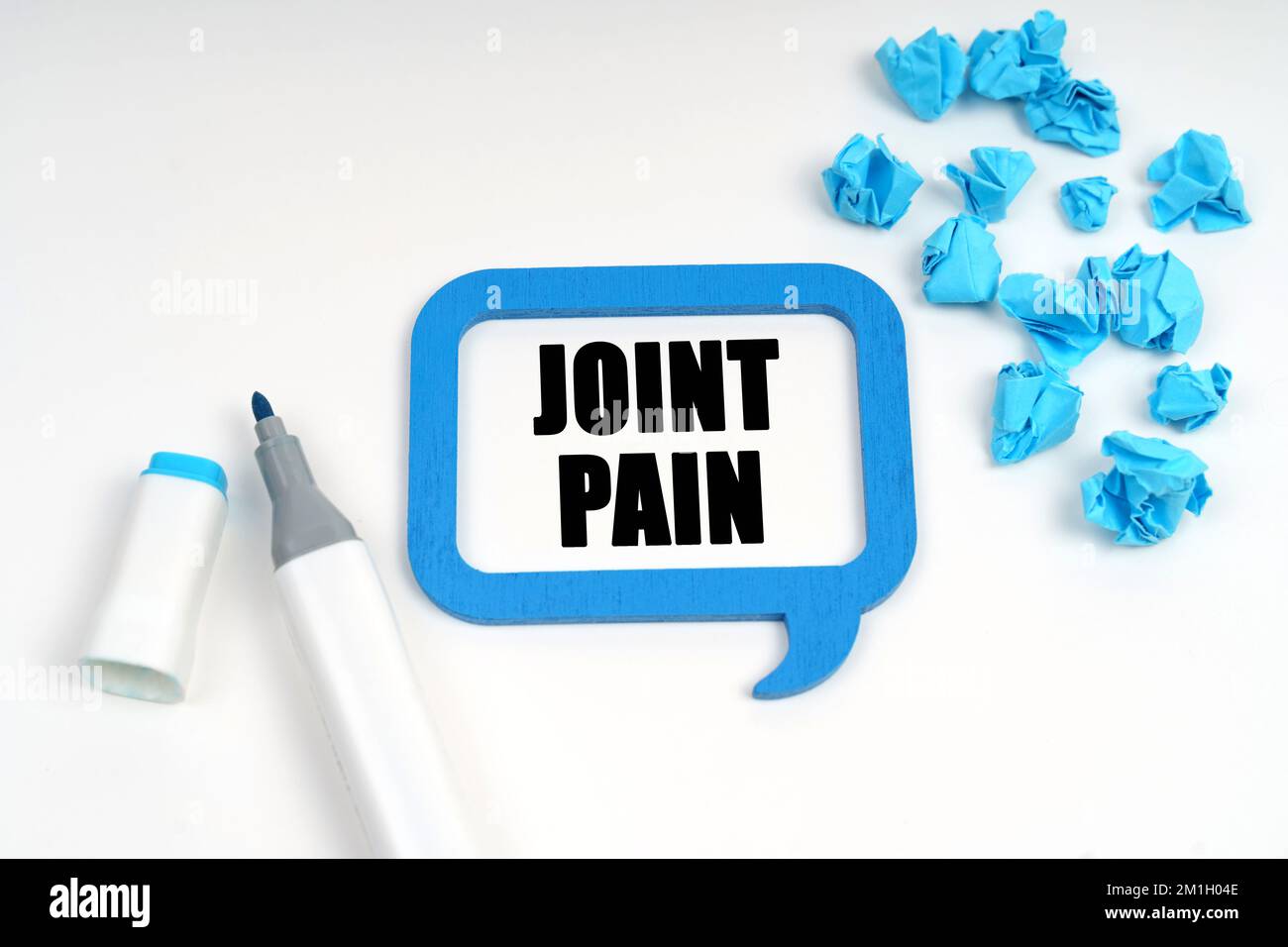 Medicine and health. On a white surface are crumpled blue paper, a ...