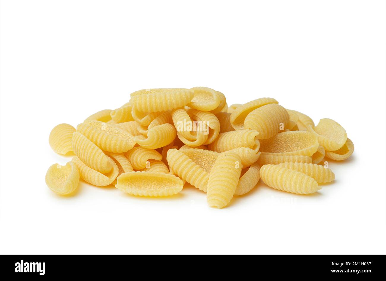 uncooked whole grain pasta on white background Stock Photo - Alamy