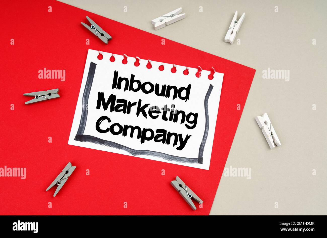 Business and finance concept. Clothespins and a sheet of notebook with ...