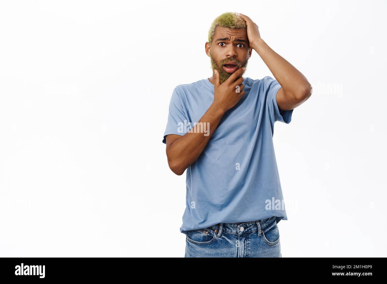 What have I done. Shocked and scared african american man, looks ...