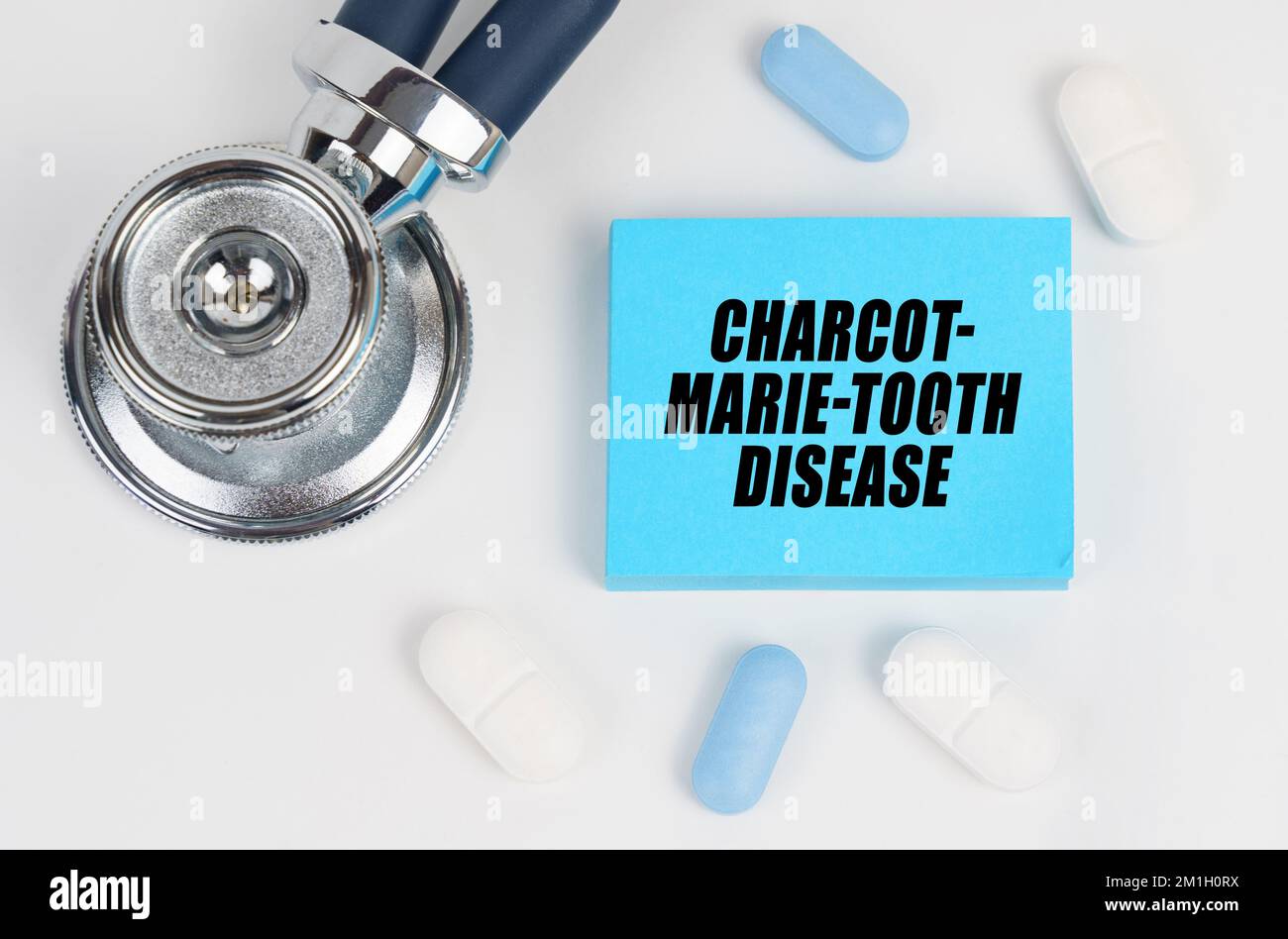 Medicine and health concept. On a white surface lie pills, a ...