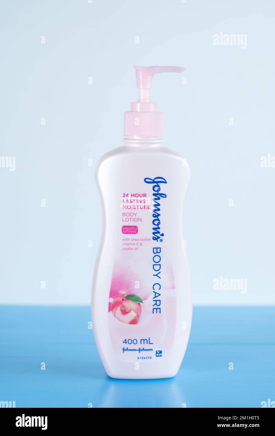 A vertical shot of Johnson's Body care body lotion bottle isolated on a ...