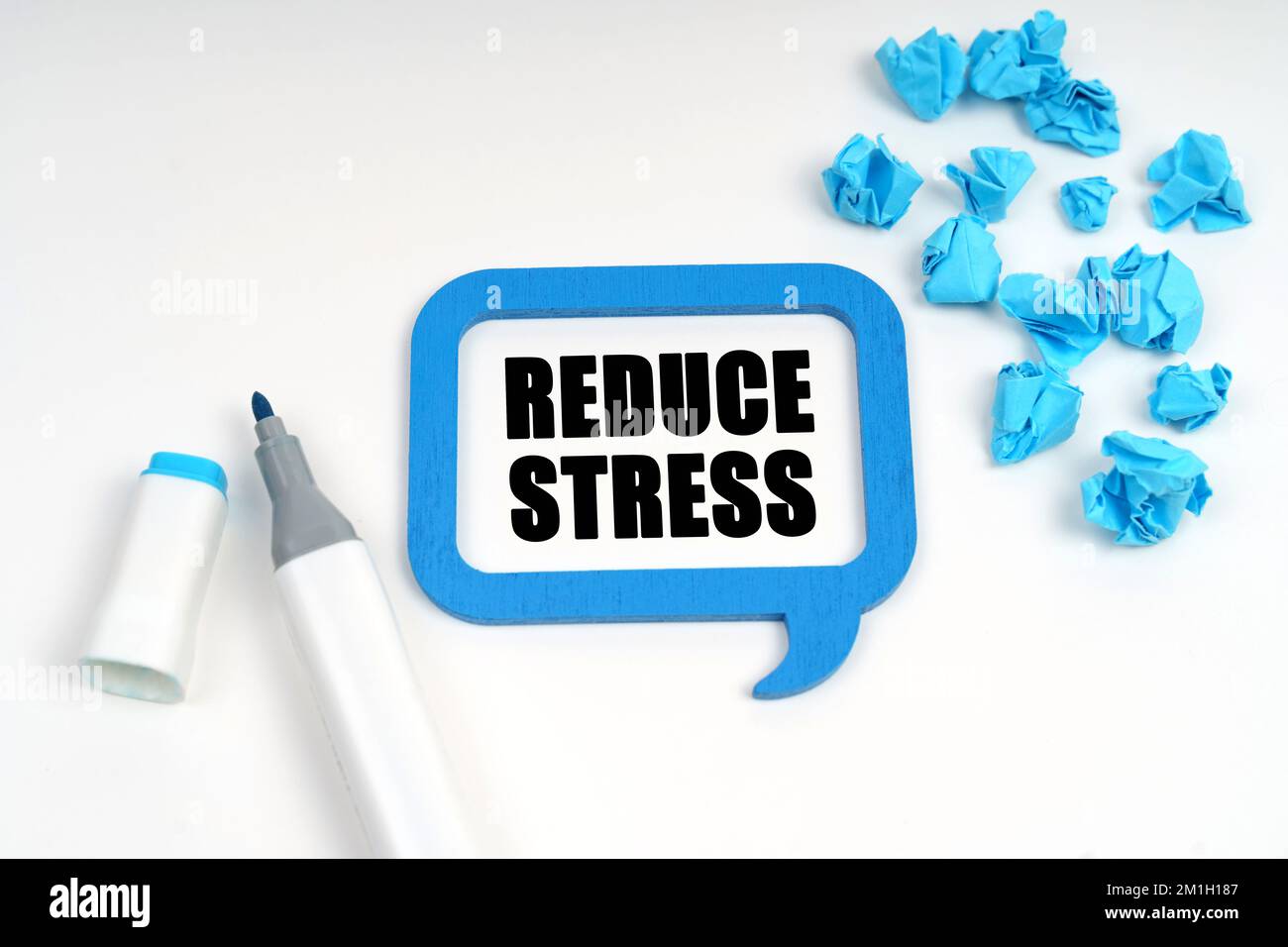 Medicine and health. On a white surface are crumpled blue paper, a ...