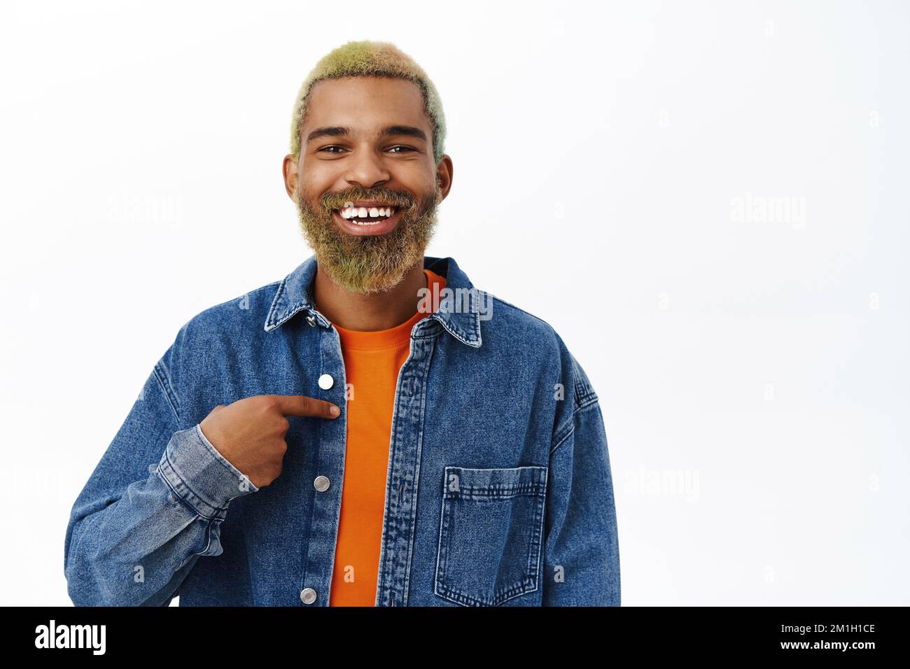 Close up of handsome smiling Black guy points at himself. Hopeful young ...