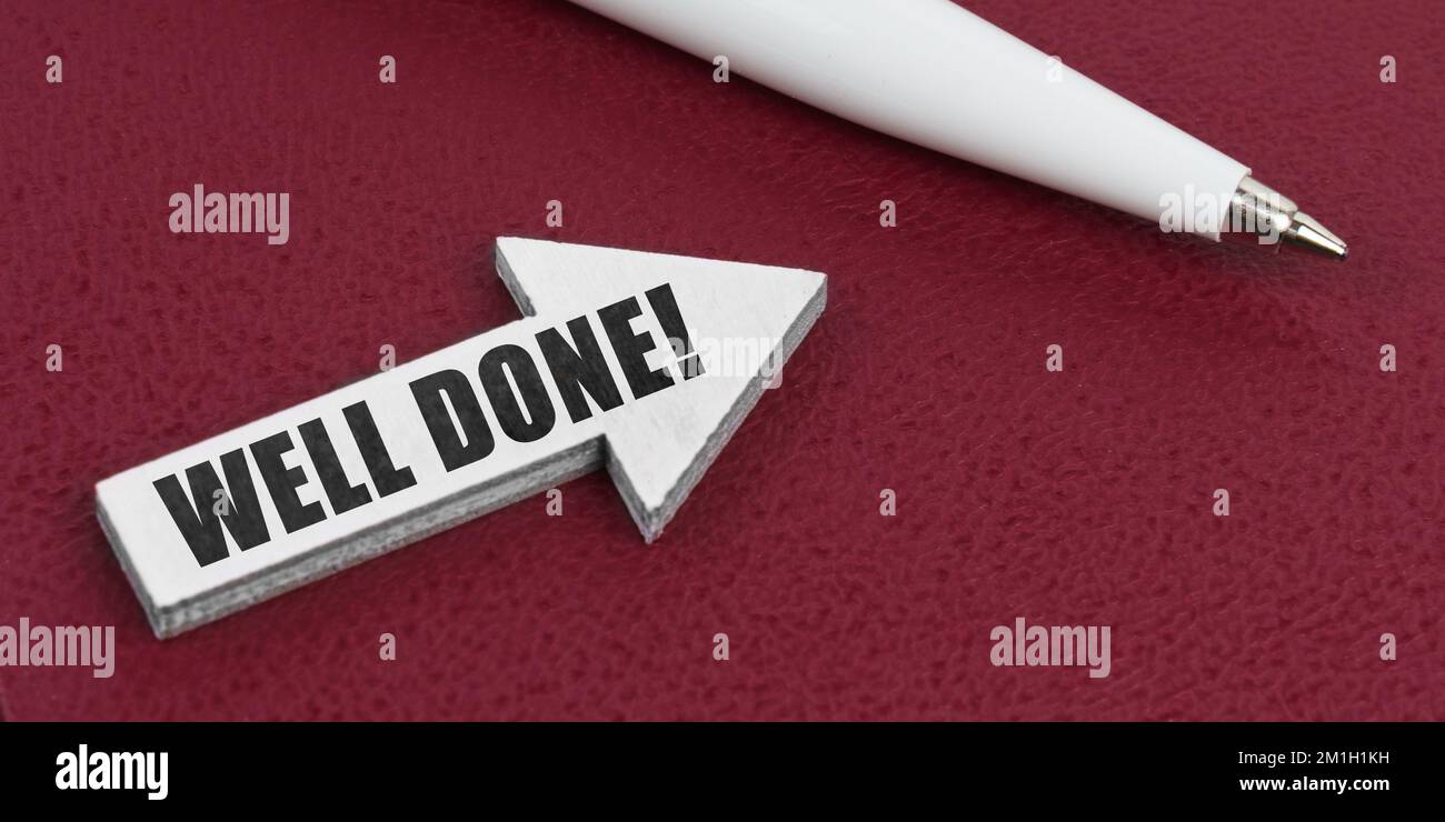 Business and finance concept. On a red background lies a white pen and ...