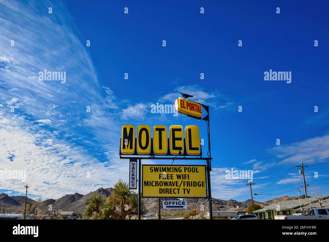 The signs on the street under a blue sky in Beatty, Nevada, United ...