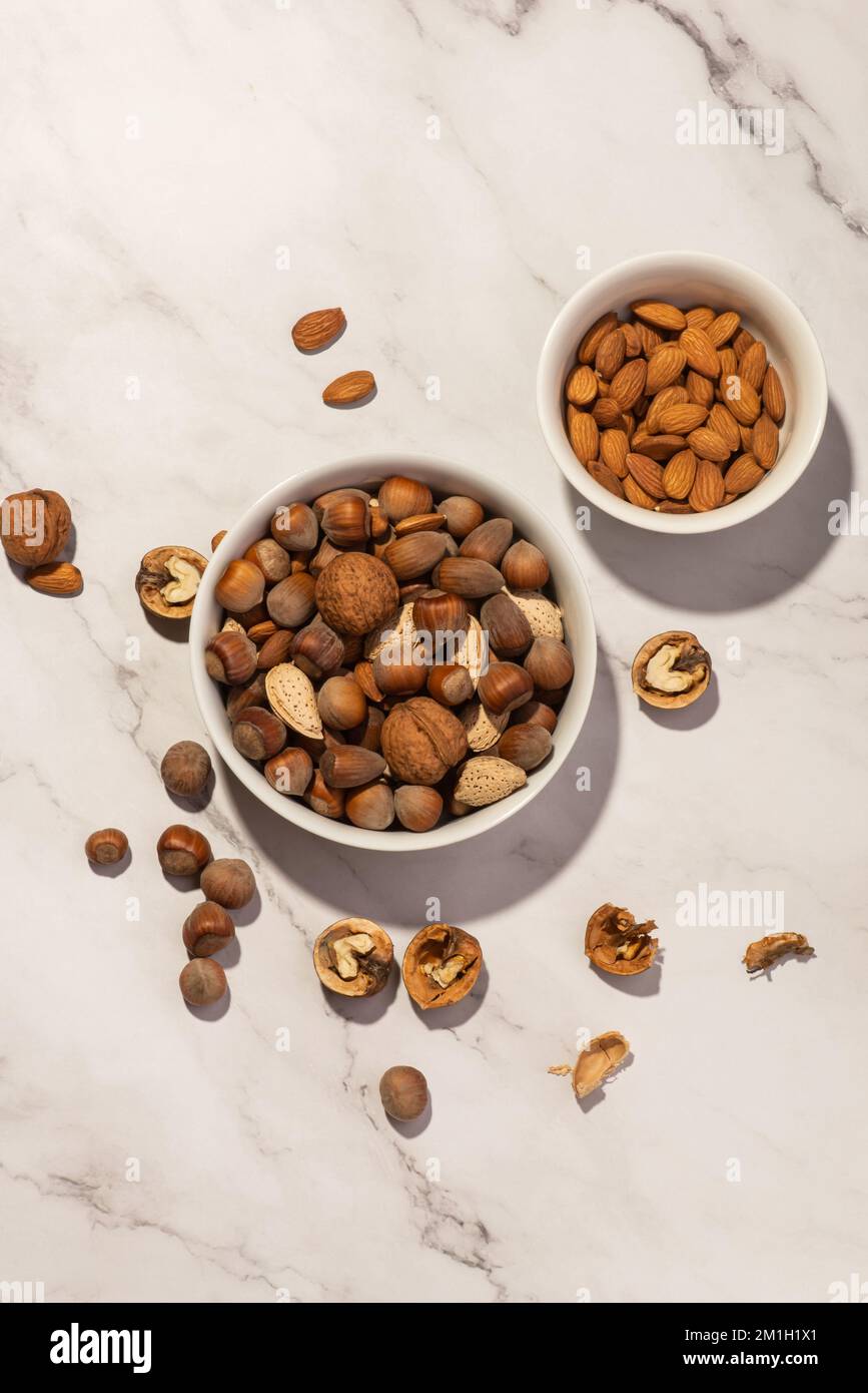 Hazelnuts white plate hi-res stock photography and images - Alamy