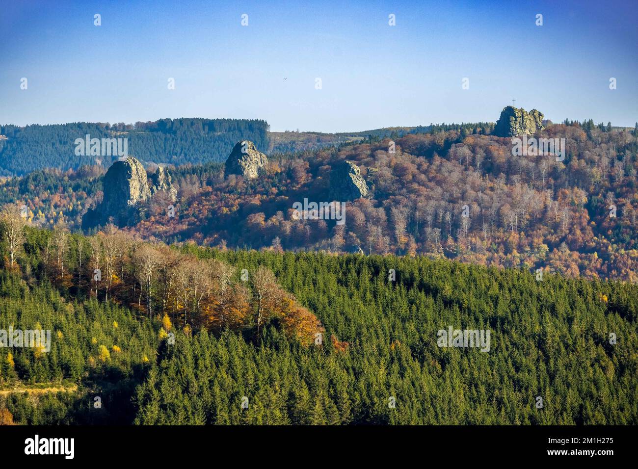 Aerial view, autumn forest and Bruchhauser stones with summit cross in ...