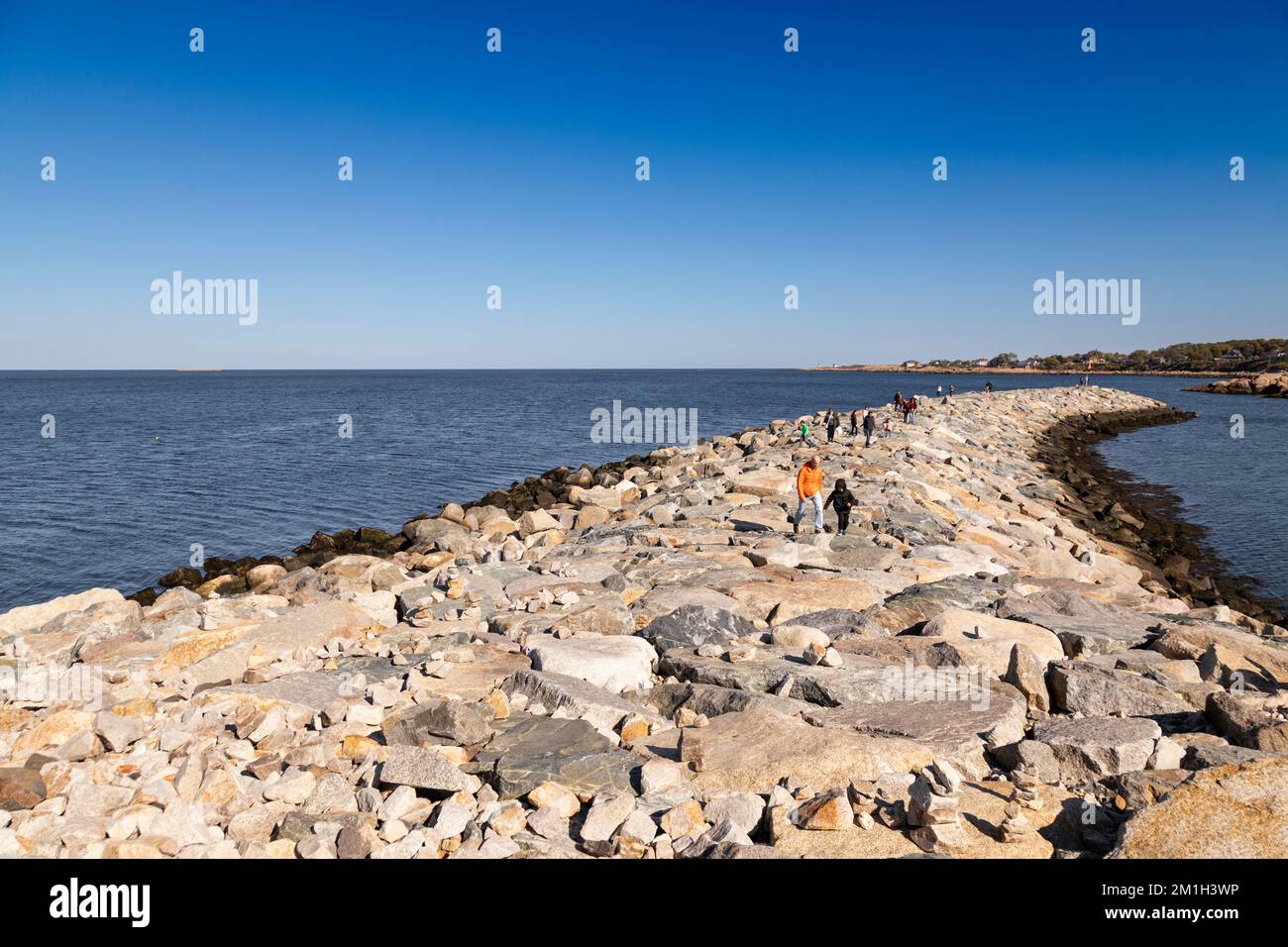 People walking on a rock Jetty, Rockport, Massachusetts, USA Stock ...