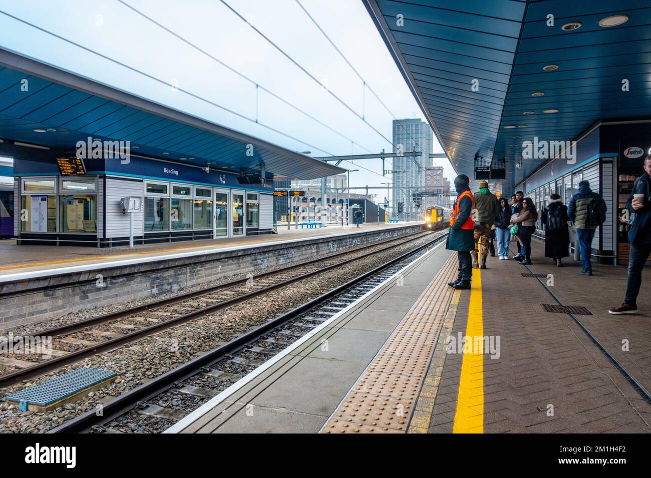 A view along the platform at Reading Railway Station in Berkshire, UK ...
