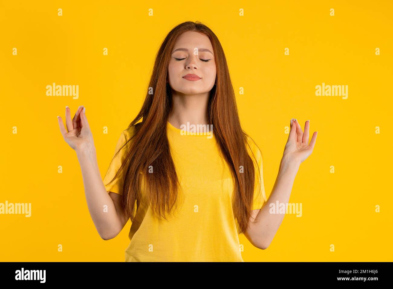 Calm woman relaxing, meditating, refuses stress. Sunny girl breathes ...