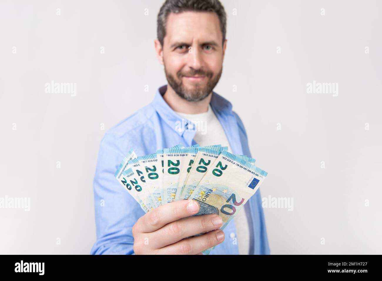 smiling man with salary money banknotes. photo of man with salary money ...