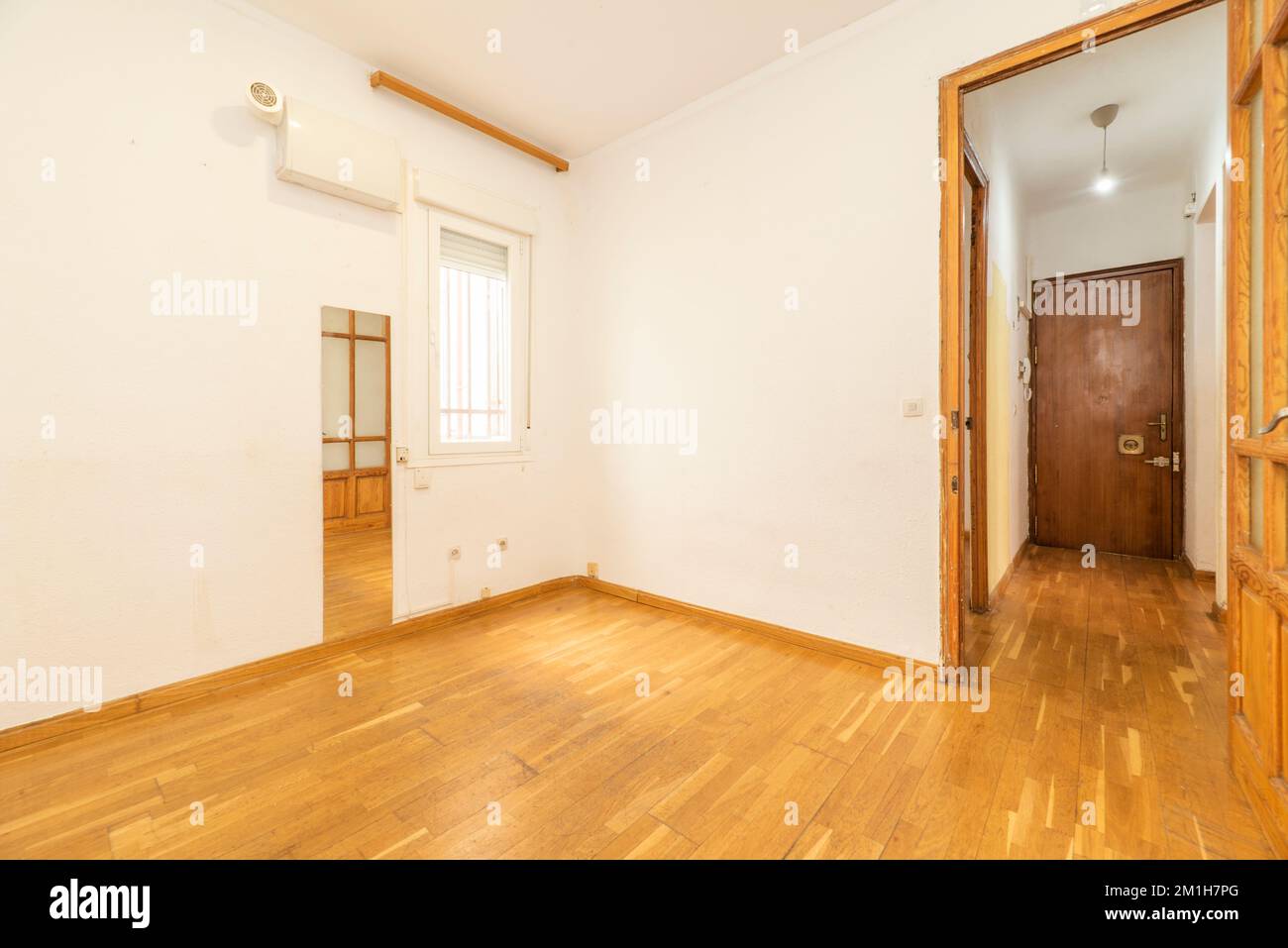 room with wooden flooring, corridors with floors of the same material ...
