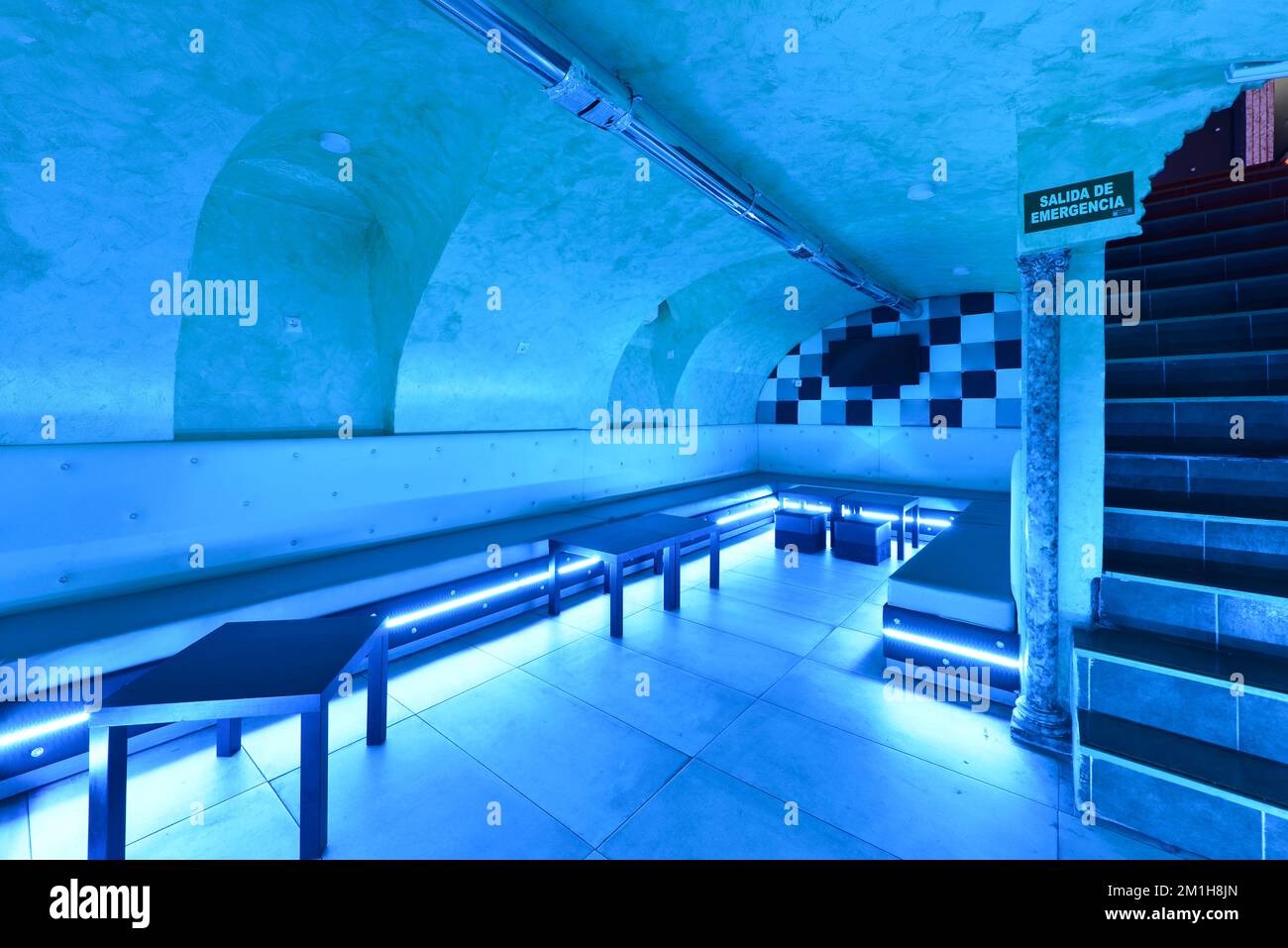 Entertainment room in an underground location with built-in stairs ...