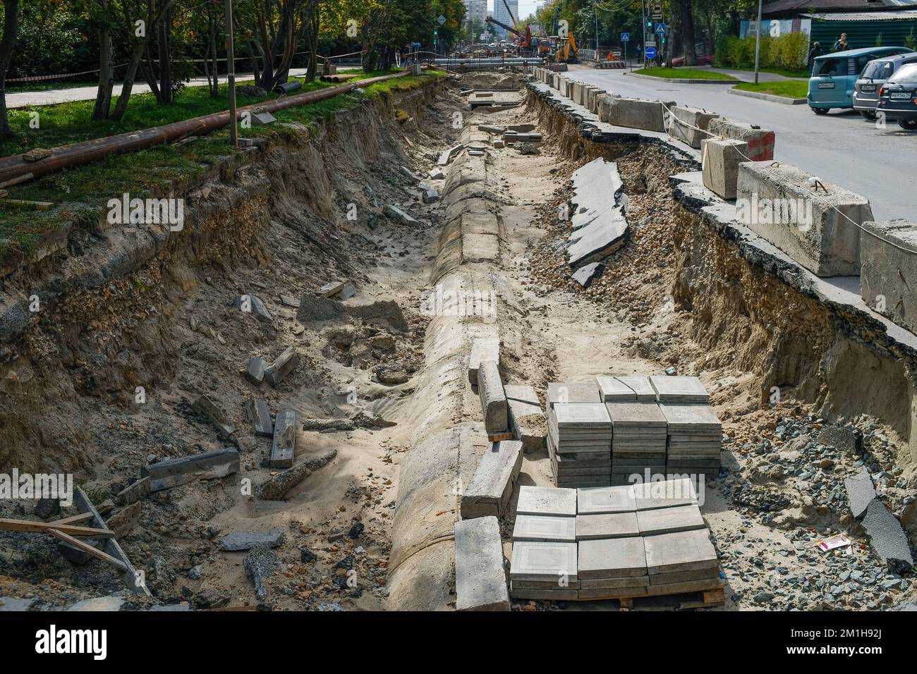 Construction work on laying heating pipes in a trench. The system of ...