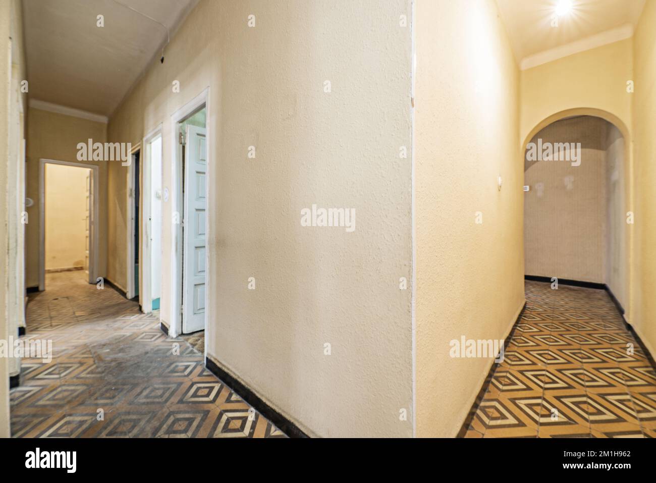 L-shaped corridors of an old house without reforms since it was built ...