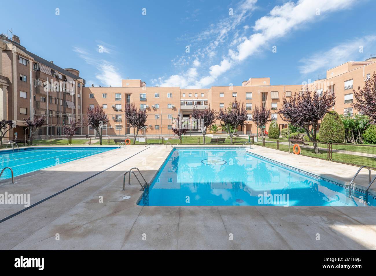 Interior facades of a block patio of residential buildings with gardens ...
