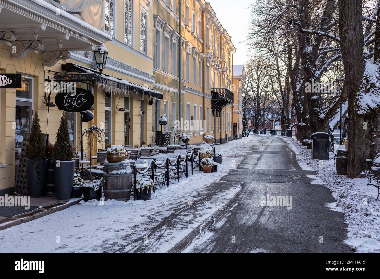 A snowy street and terrace by Aura River in Turku, Finland Stock Photo ...