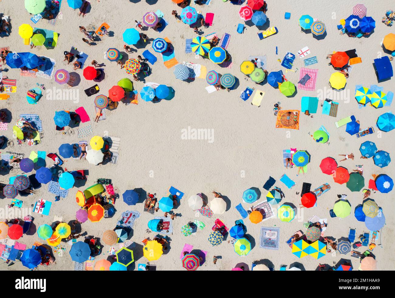 Aerial view of colorful umbrellas on sandy beach and people Stock Photo - Alamy