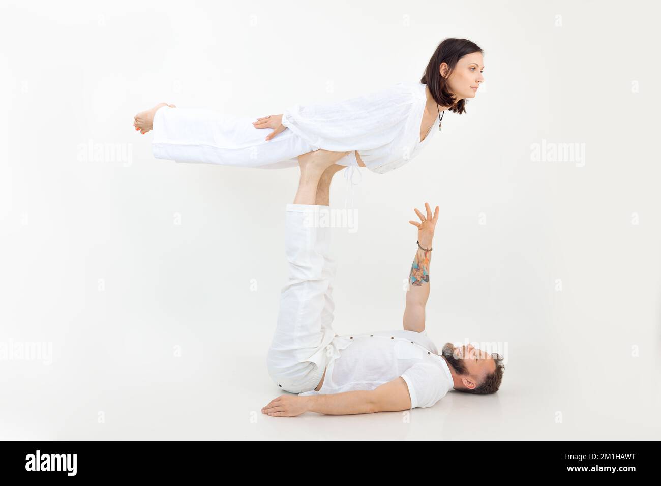 Fit family on white background. Middle-aged man lying, holding with ...
