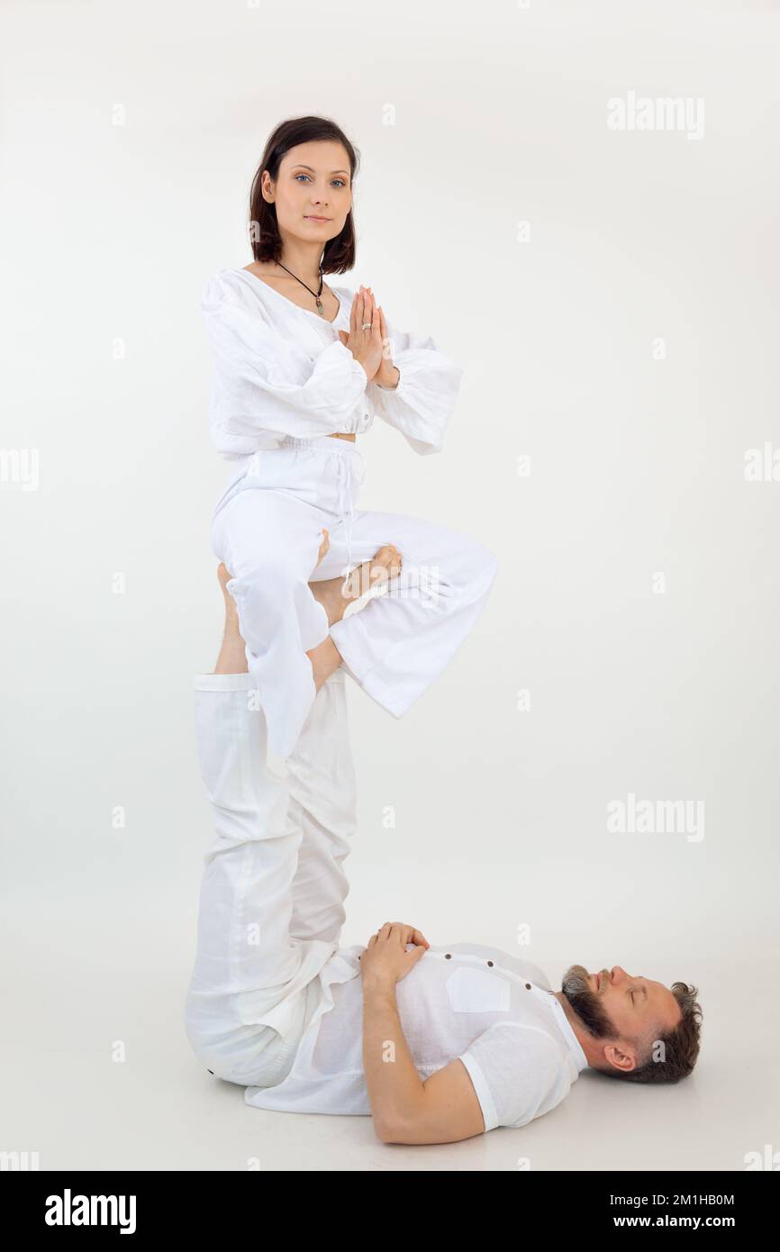Portrait of sporty family training on white background. Man lying on ...
