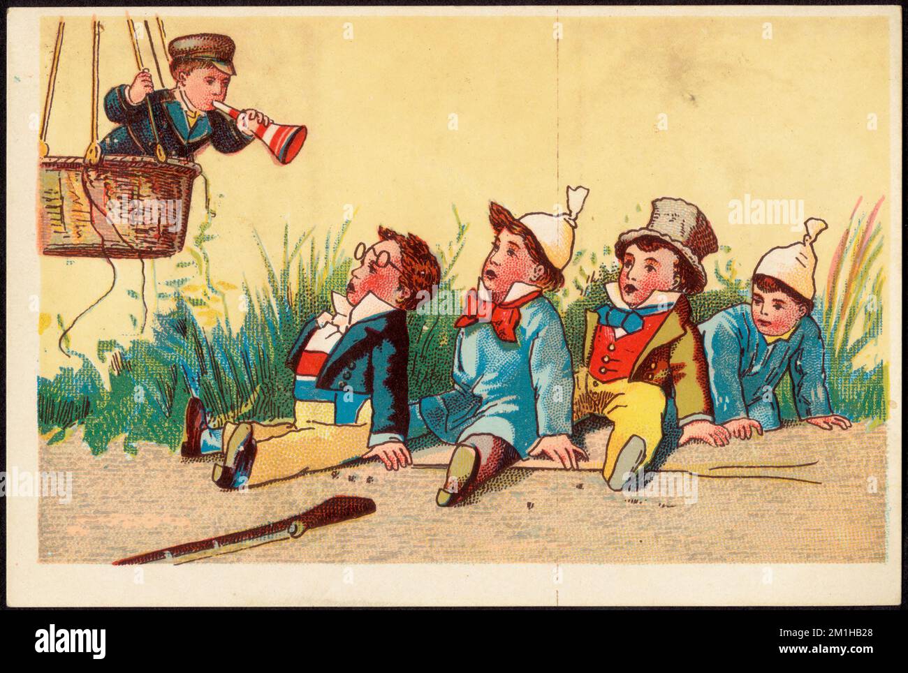 Five boys, four sitting and looking upwards at a boy in the basket of a ...