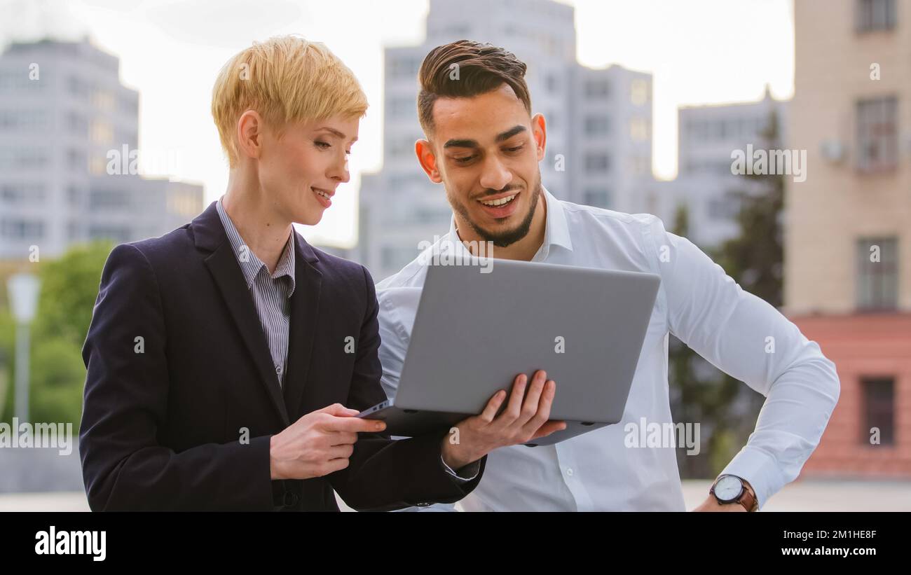 Serious diverse multiracial couple colleagues arabic hispanic man and ...