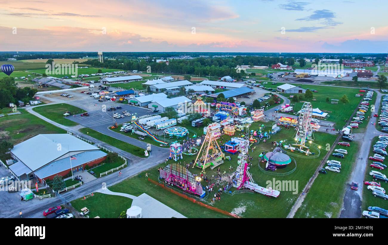 Dusk light aerial over American county fair with carnival Stock Photo ...