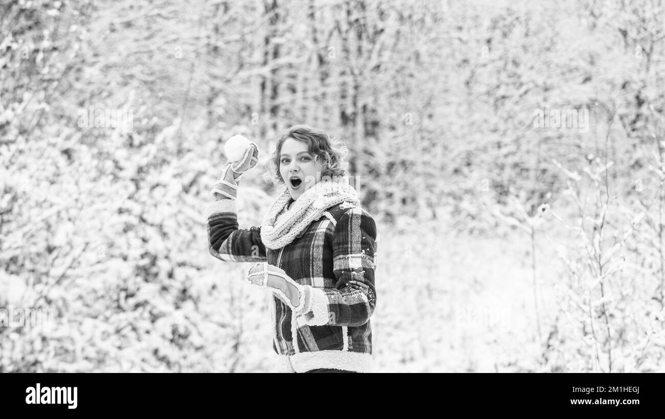 Having fun with snowball. Snow games. Positivity concept. Girl play ...