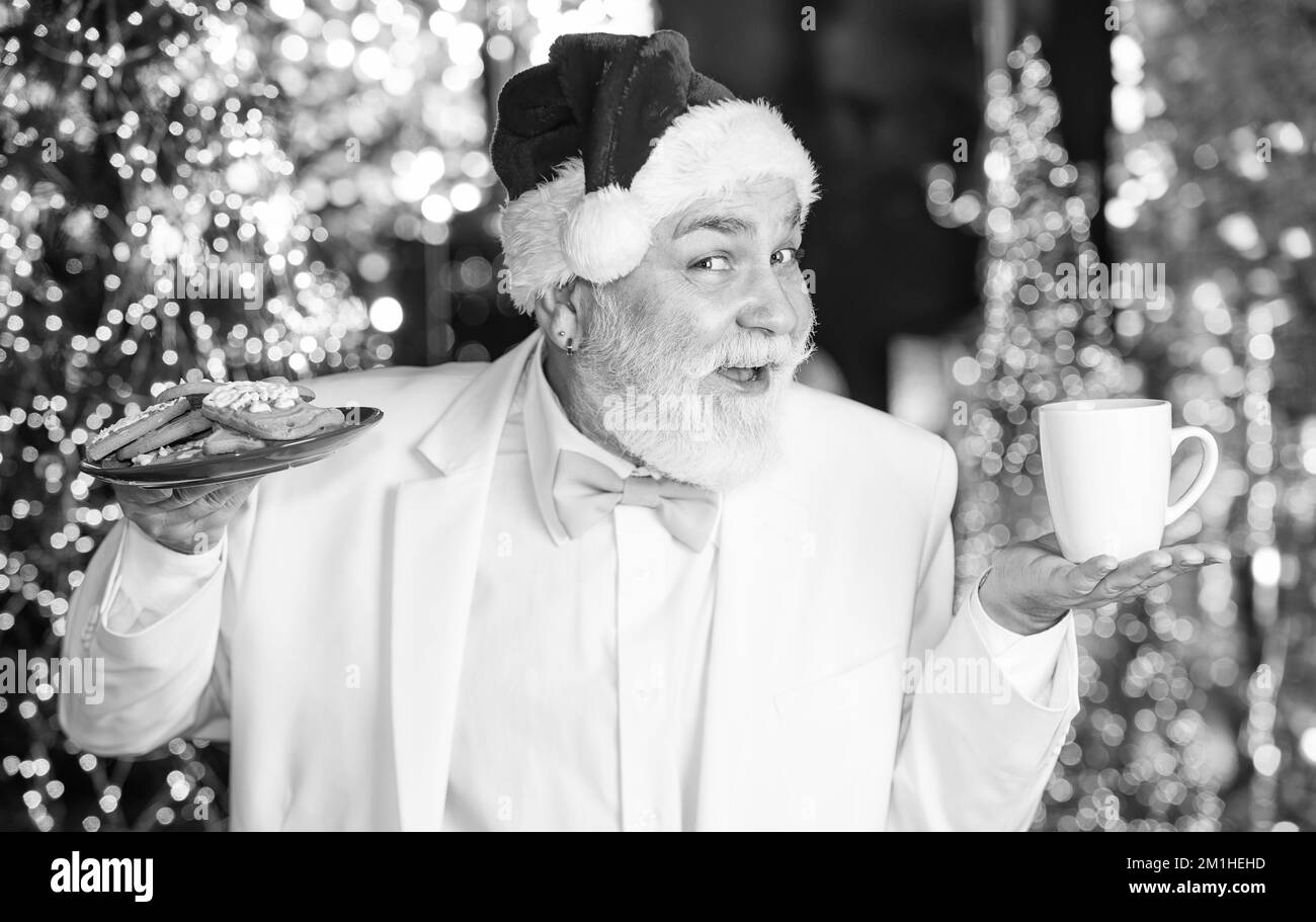Merry christmas. Bearded senior man Santa Claus. Santa Claus relaxing ...