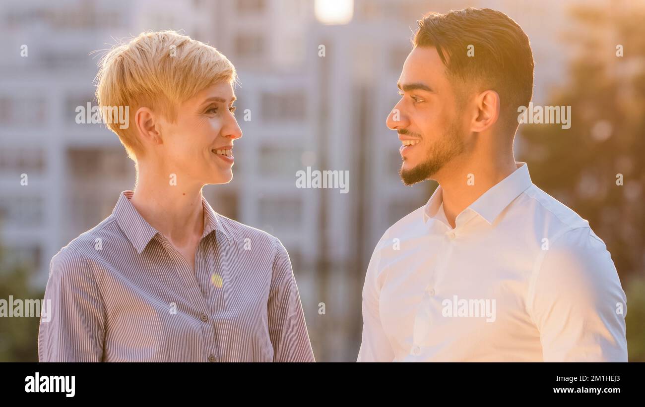 Multiracial business colleague couple arabic hispanic man and mature ...