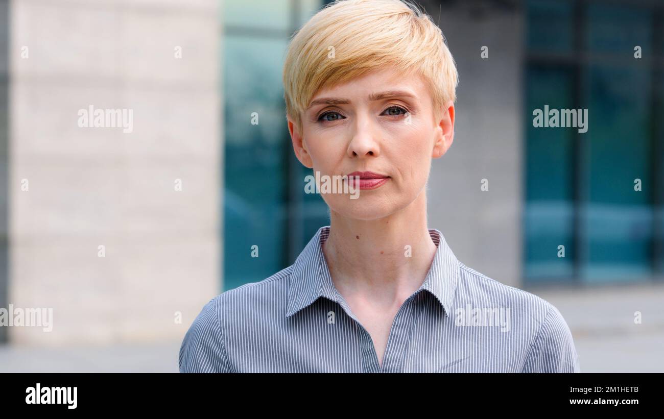 Close-up female serious face portrait outdoors caucasian middle aged ...