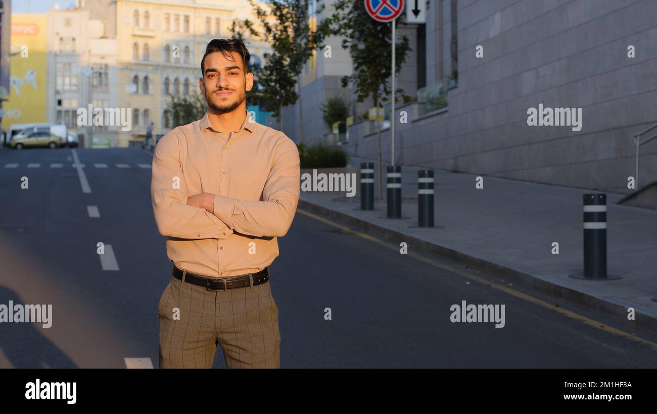 Successful hispanic business man arabic guy stands in city outdoors ...