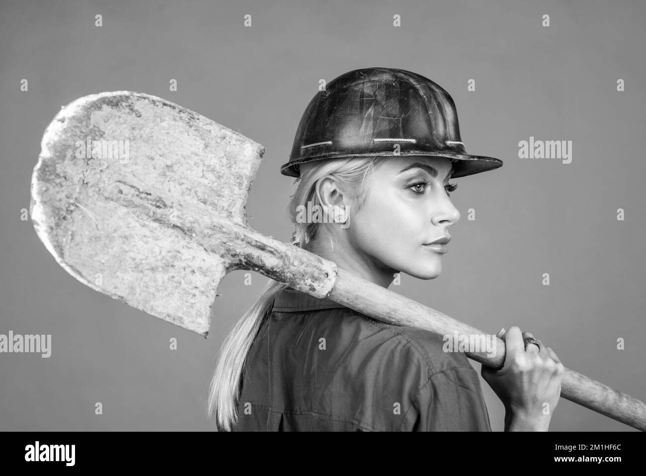 lets work. labor day. woman in boilersuit and helmet. female builder ...