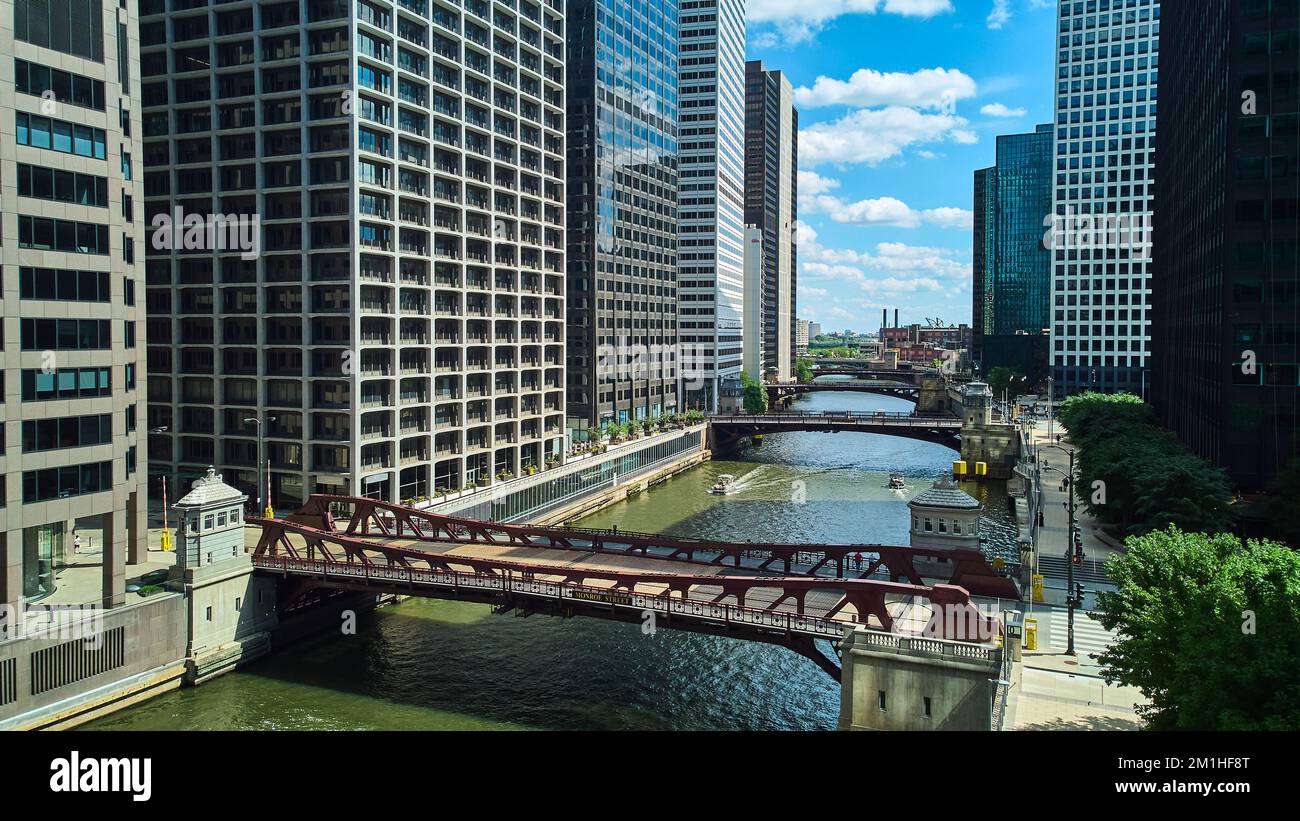 View down row of bridges through the Chicago ship canal surrounded by ...