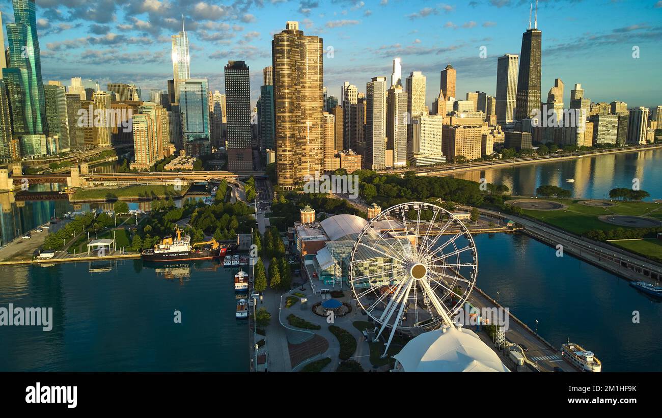 Chicago ferris wheel on Navy Pier next to stunning skyline in morning ...