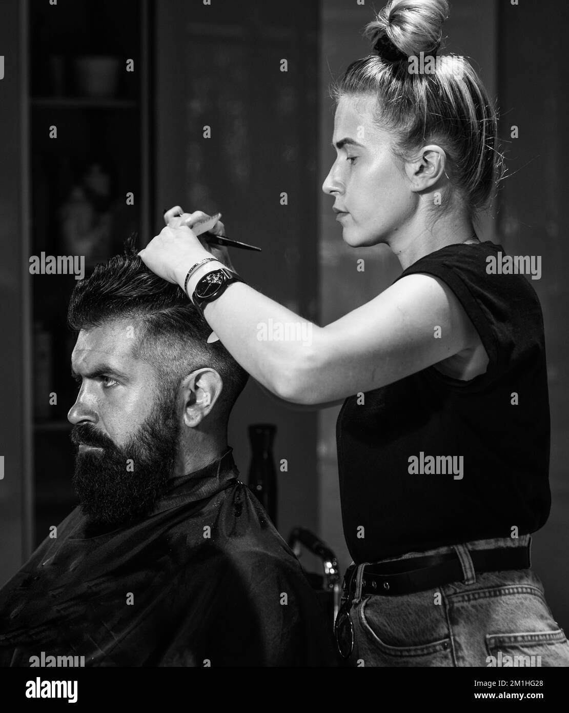 mature caucasian male visiting barbershop brings a beard and hair in ...