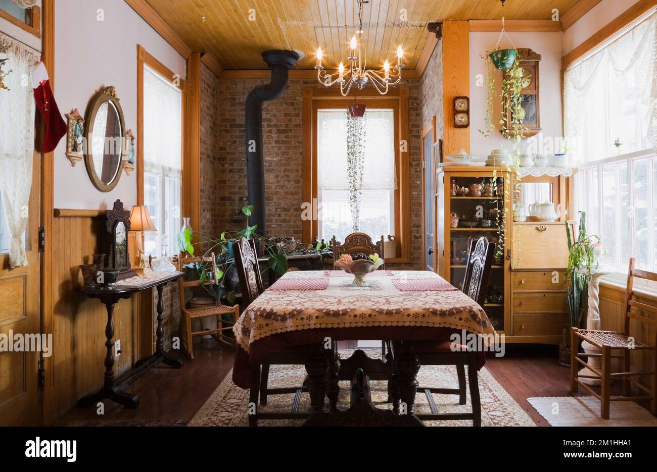 Antique wooden table and high back chairs in dining room inside old ...
