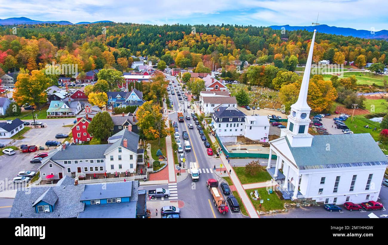 Church aerial in small town of Stowe, Vermont during peak fall foliage ...