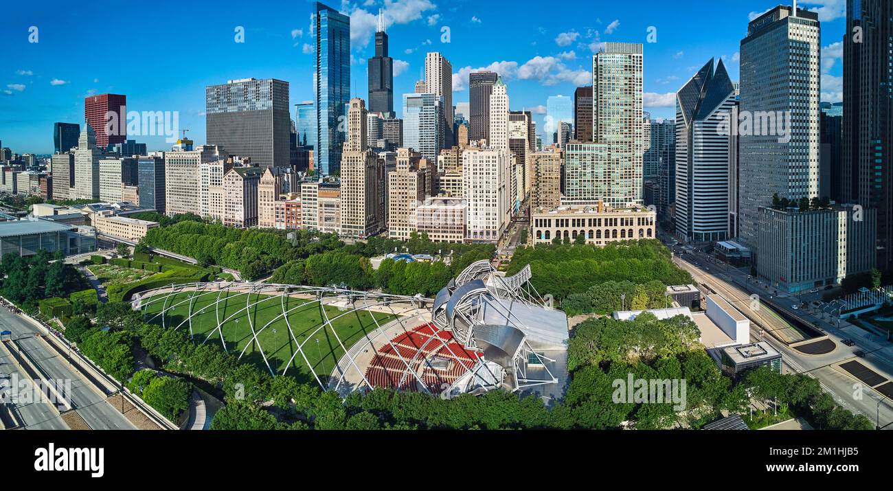 Wide view over Millennium Park with pavilion and line of skyscrapers ...