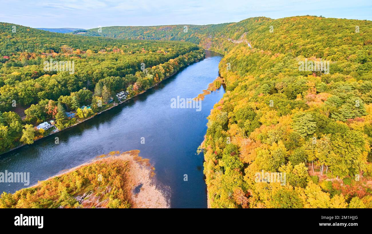 Aerial over stunning Delaware River with fall foliage forests around ...